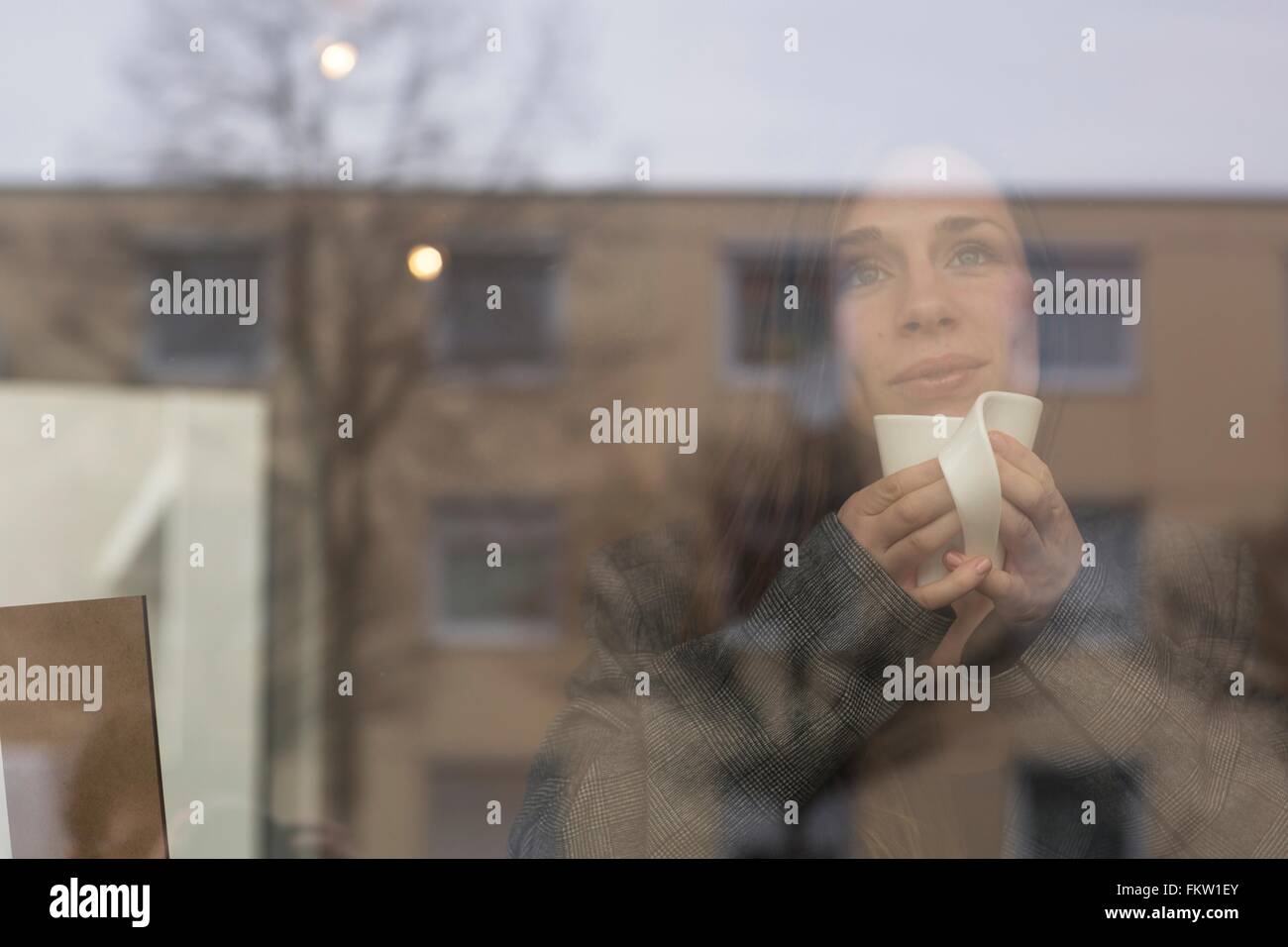 Woman gazing at reflection hi-res stock photography and images - Alamy