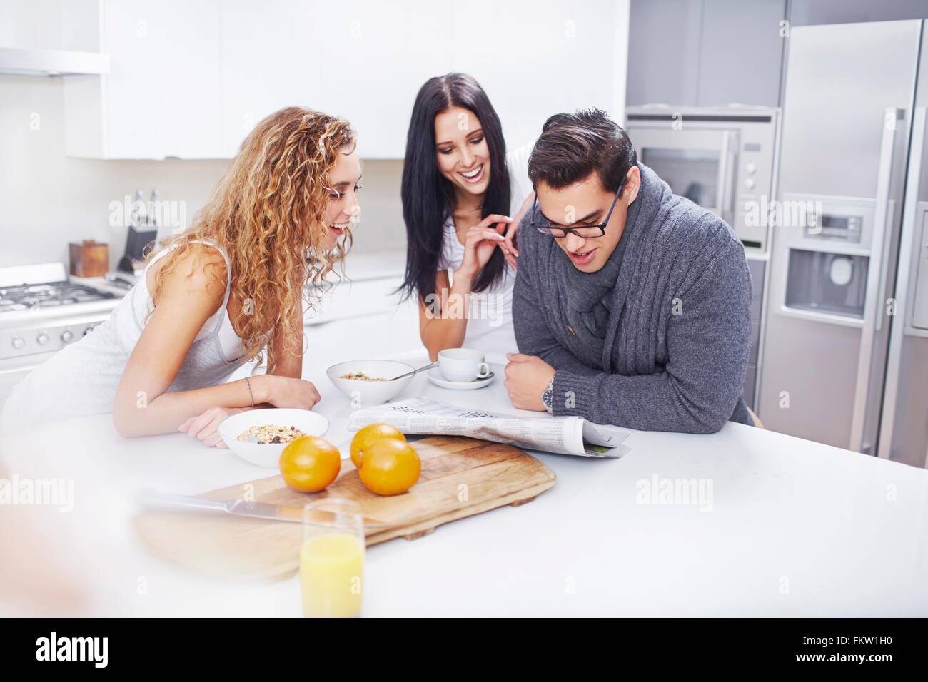 Young people reading newspaper hi-res stock photography and images - Alamy
