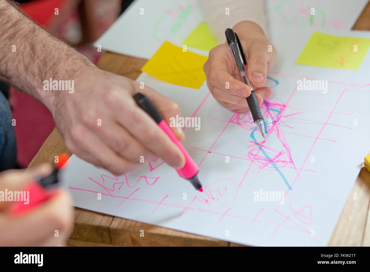 People writing on paper Stock Photo - Alamy