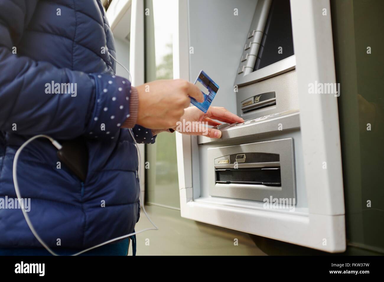 Using the cash machine hi-res stock photography and images - Alamy