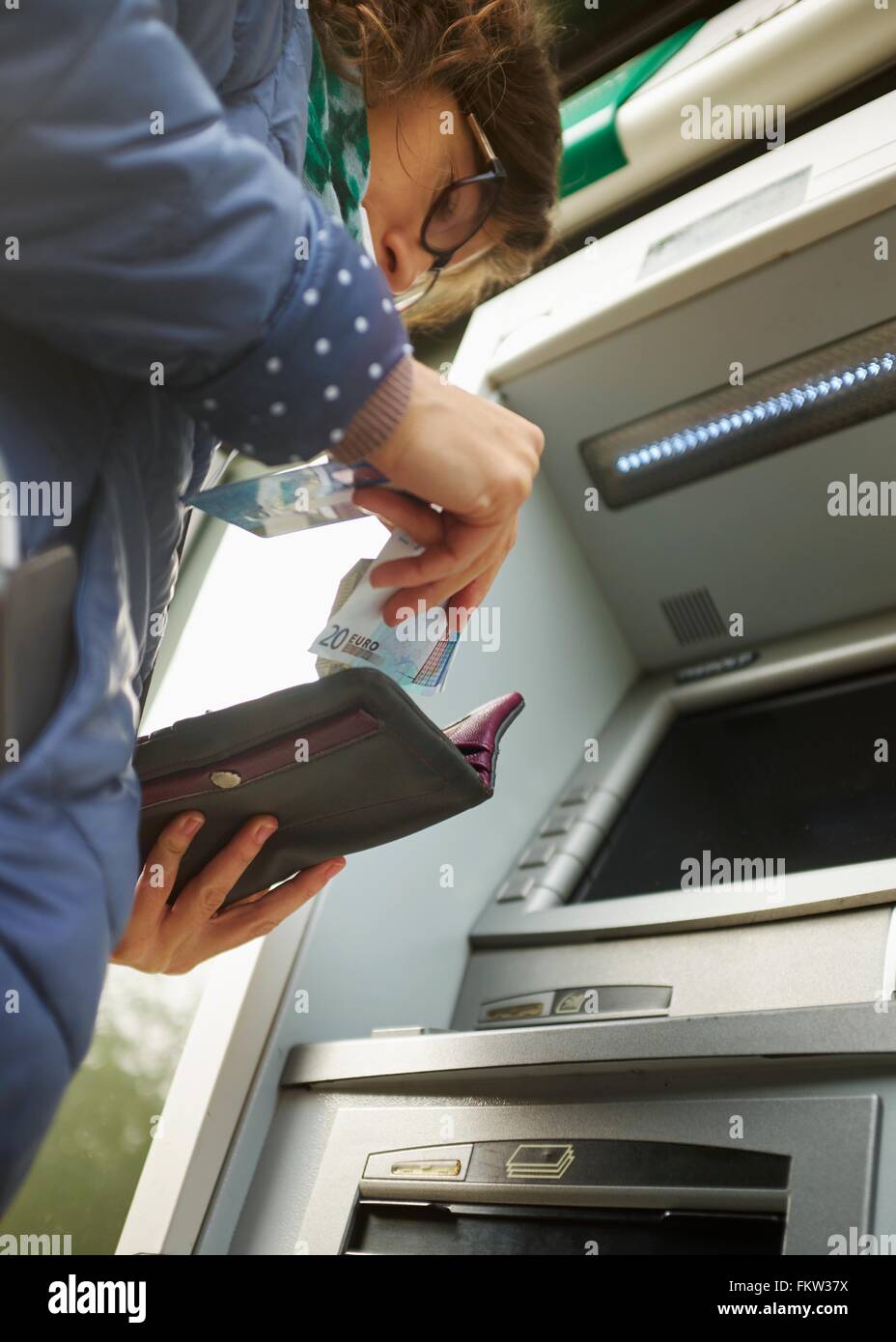 Money woman purse hi-res stock photography and images - Alamy