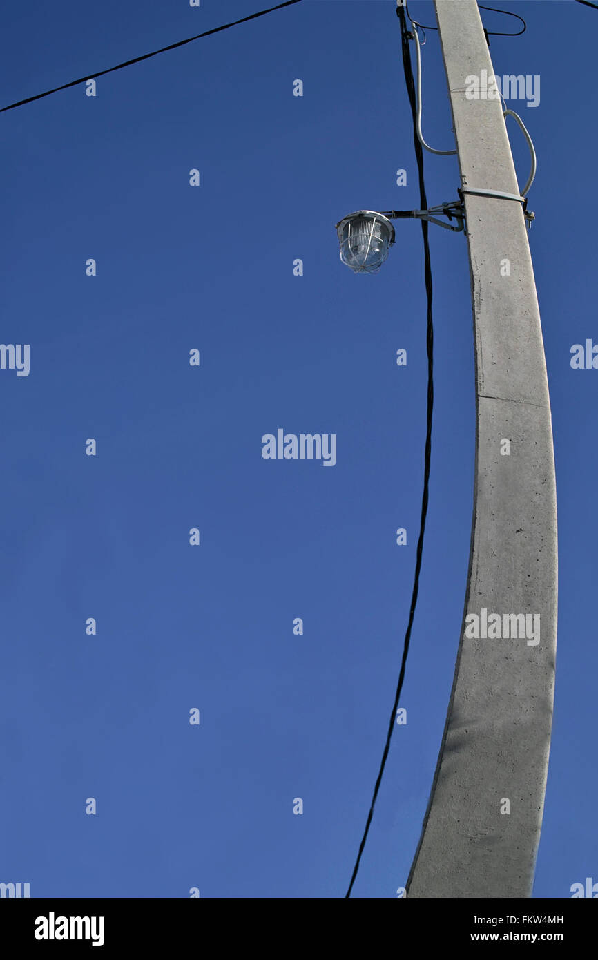 Bent electric post Stock Photo - Alamy