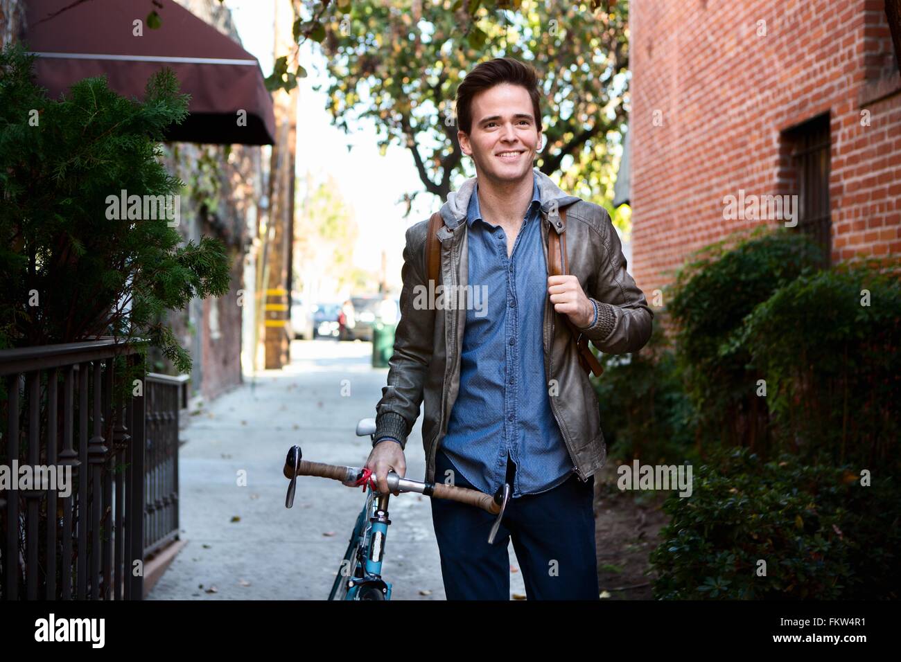 Man walking with cycle hi-res stock photography and images - Alamy