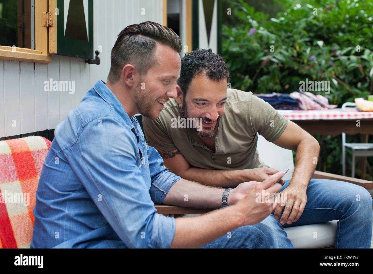 Two men reading hi-res stock photography and images - Alamy