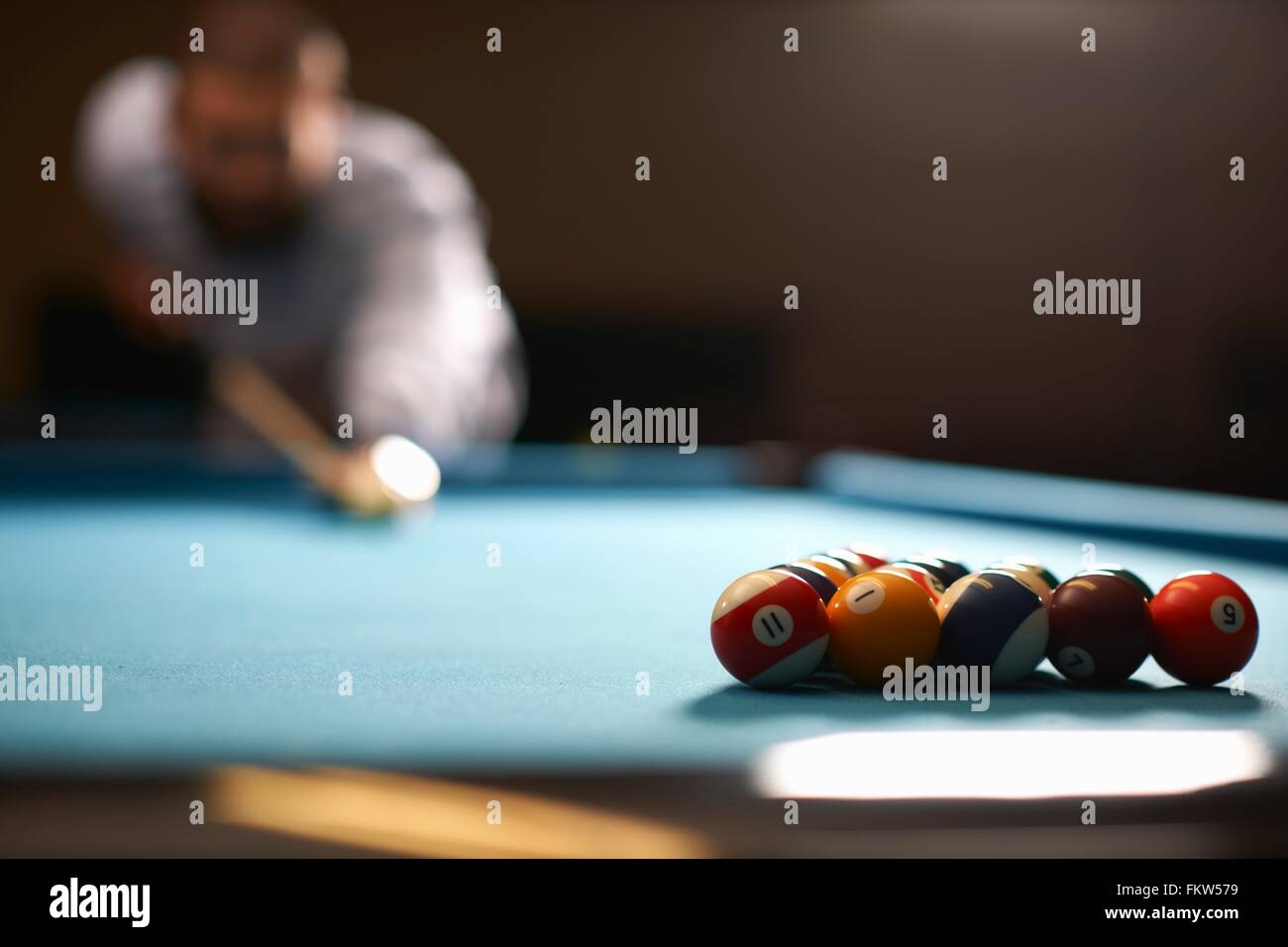 Man playing pool in club Stock Photo - Alamy