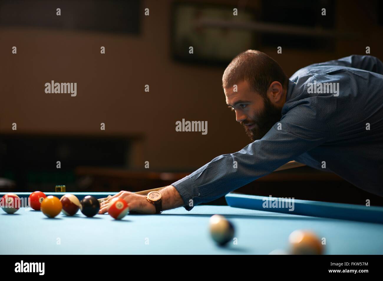 Man playing pool Stock Photo - Alamy