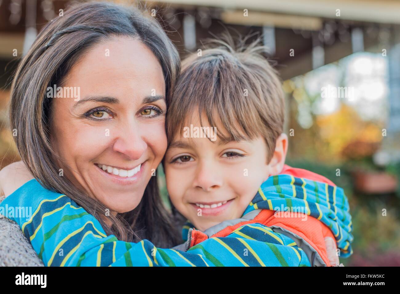 Mother hugging son Stock Photo - Alamy