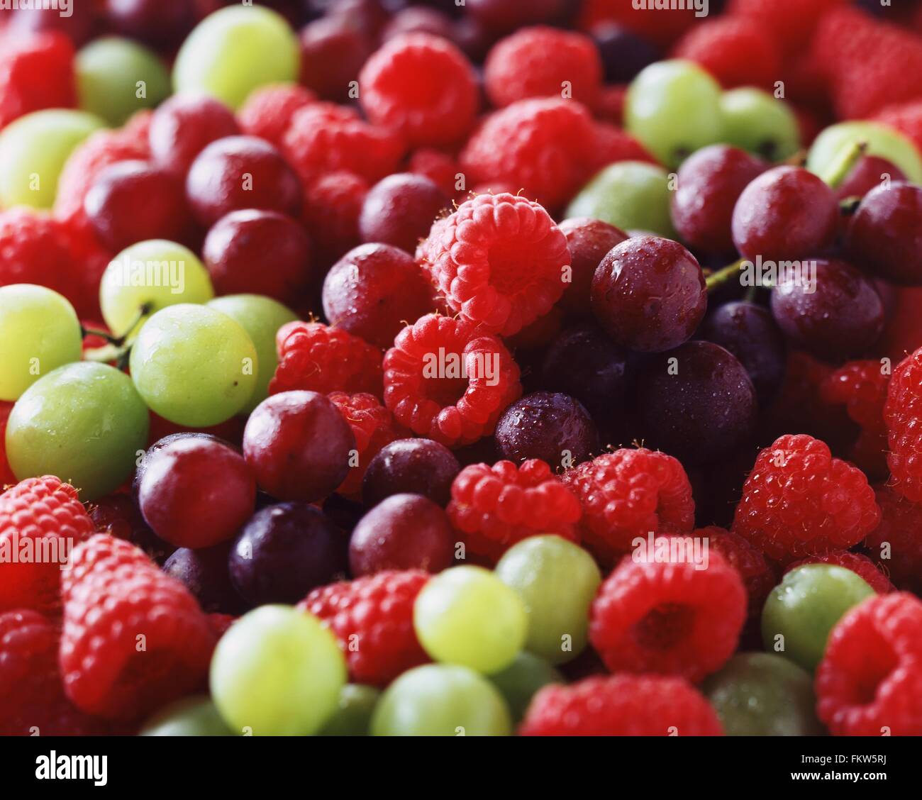 Fresh raspberries, red and green grapes Stock Photo - Alamy