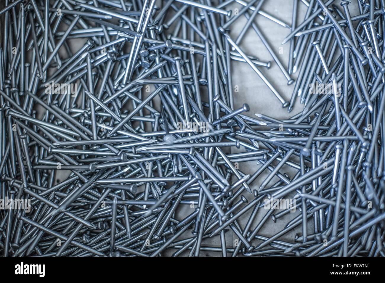 Stack of silver metal nails Stock Photo - Alamy