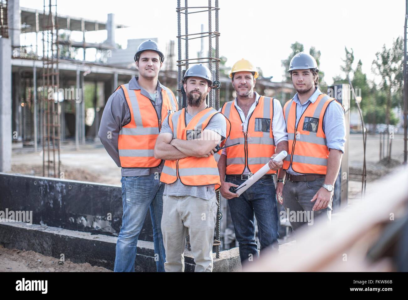 Portrait of site manager and building team on construction site Stock ...