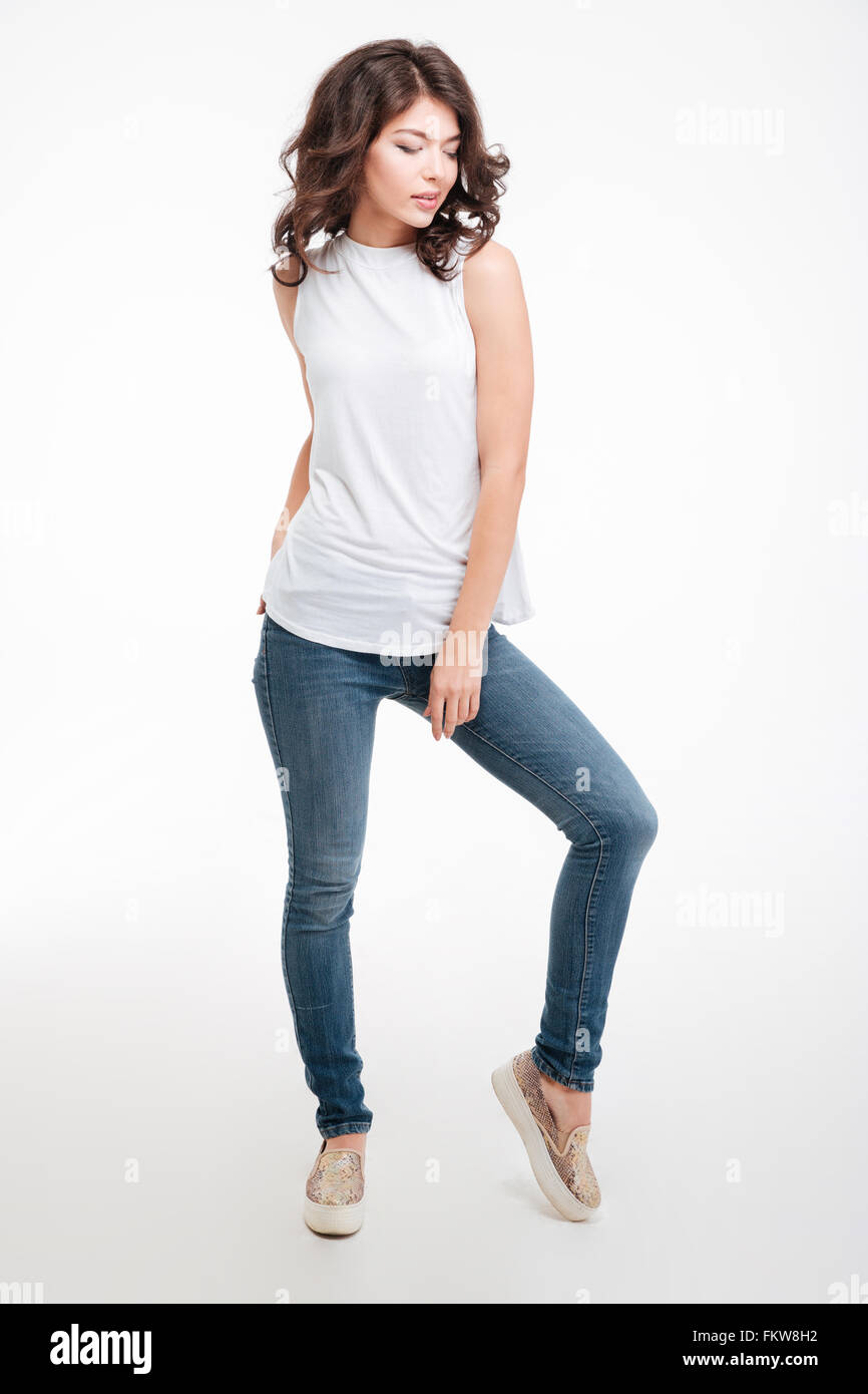 Full length portrait of a casual beautiful woman posing isolated on a ...