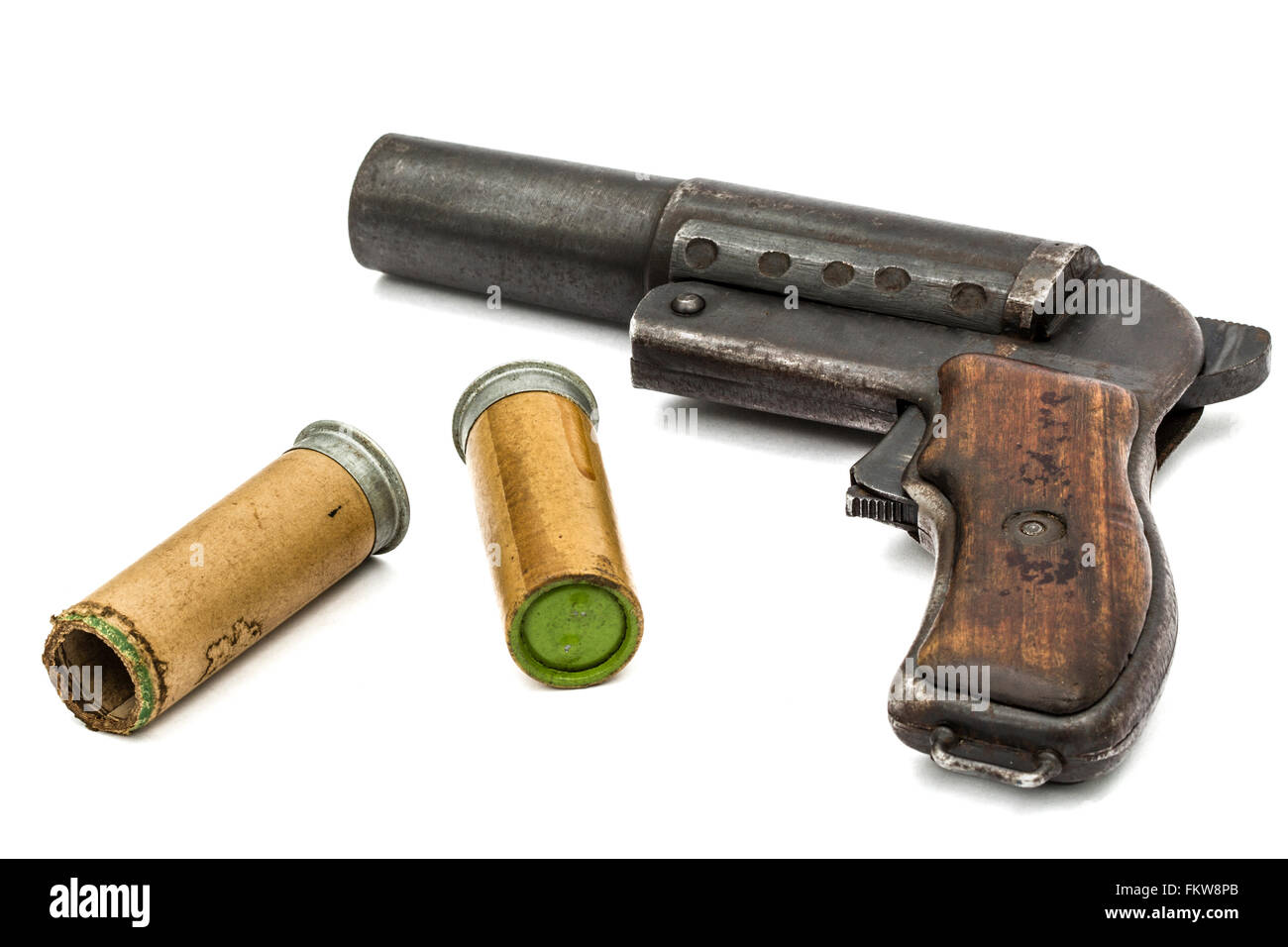 Old signal pistol, flare gun and cartridges, isolated on white ...