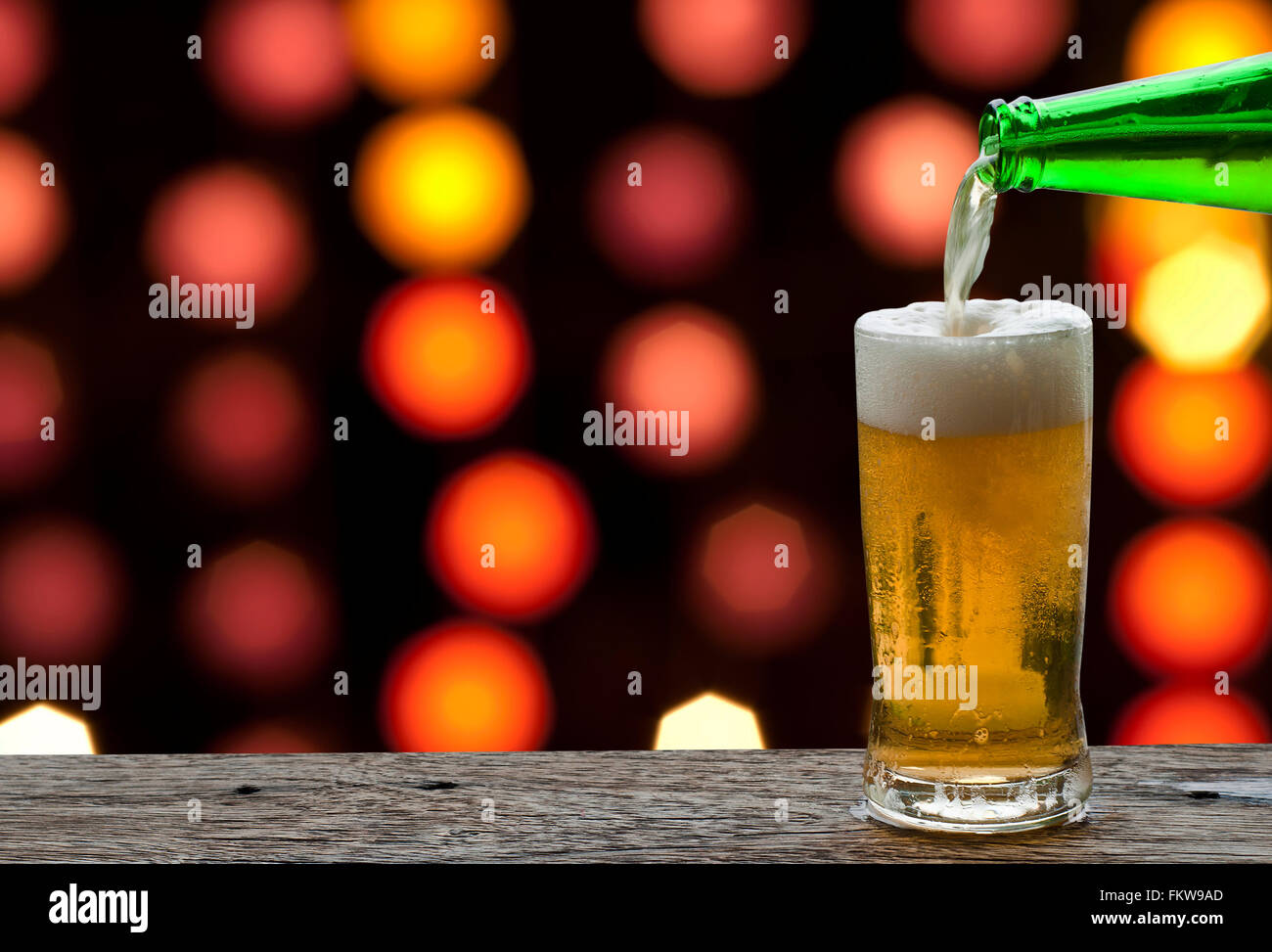 Enjoy beer in night club Stock Photo - Alamy