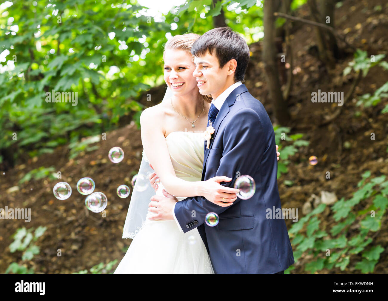 Wedding, Beautiful Romantic Bride and Groom Embracing Stock Photo - Alamy
