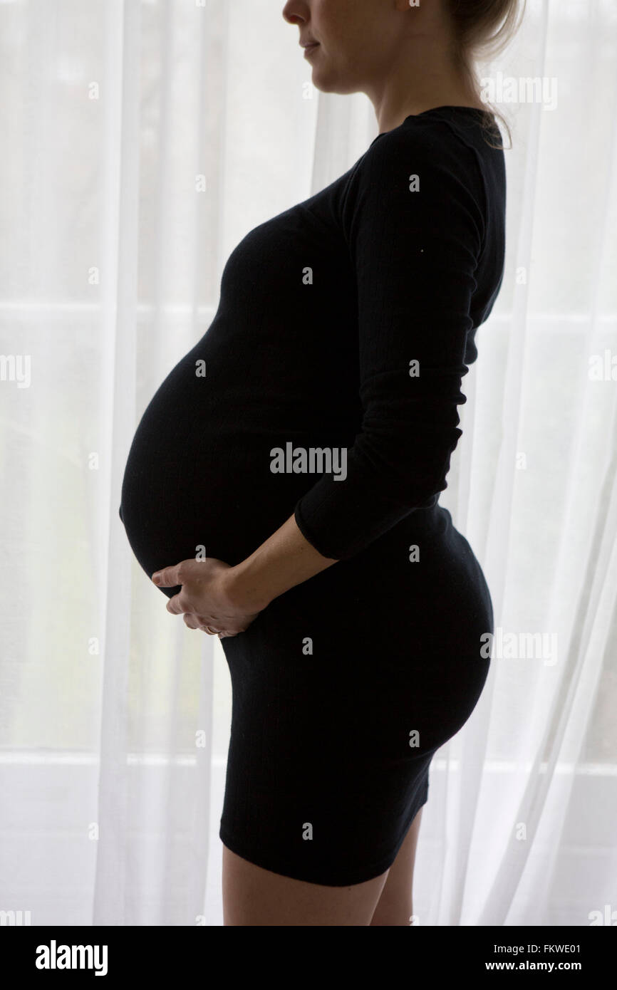 A woman in her 8th month of pregnancy Stock Photo - Alamy