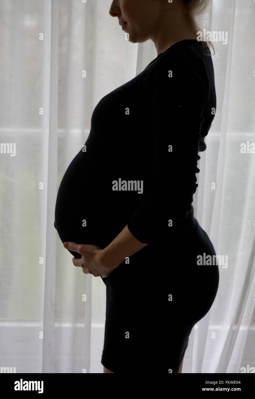 A woman in her 8th month of pregnancy Stock Photo - Alamy