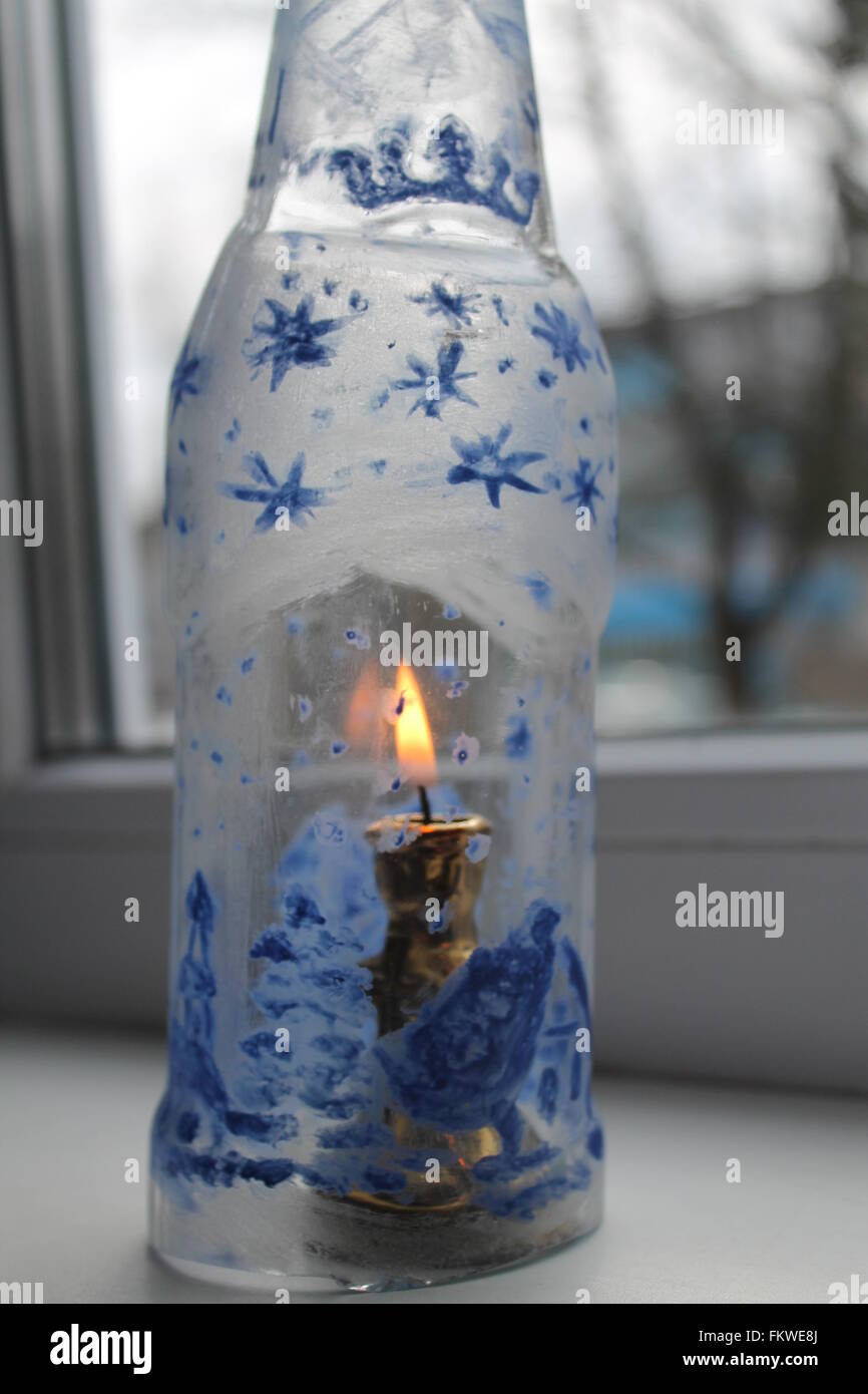 fragile glass bottle with picture of winter country at night with ...