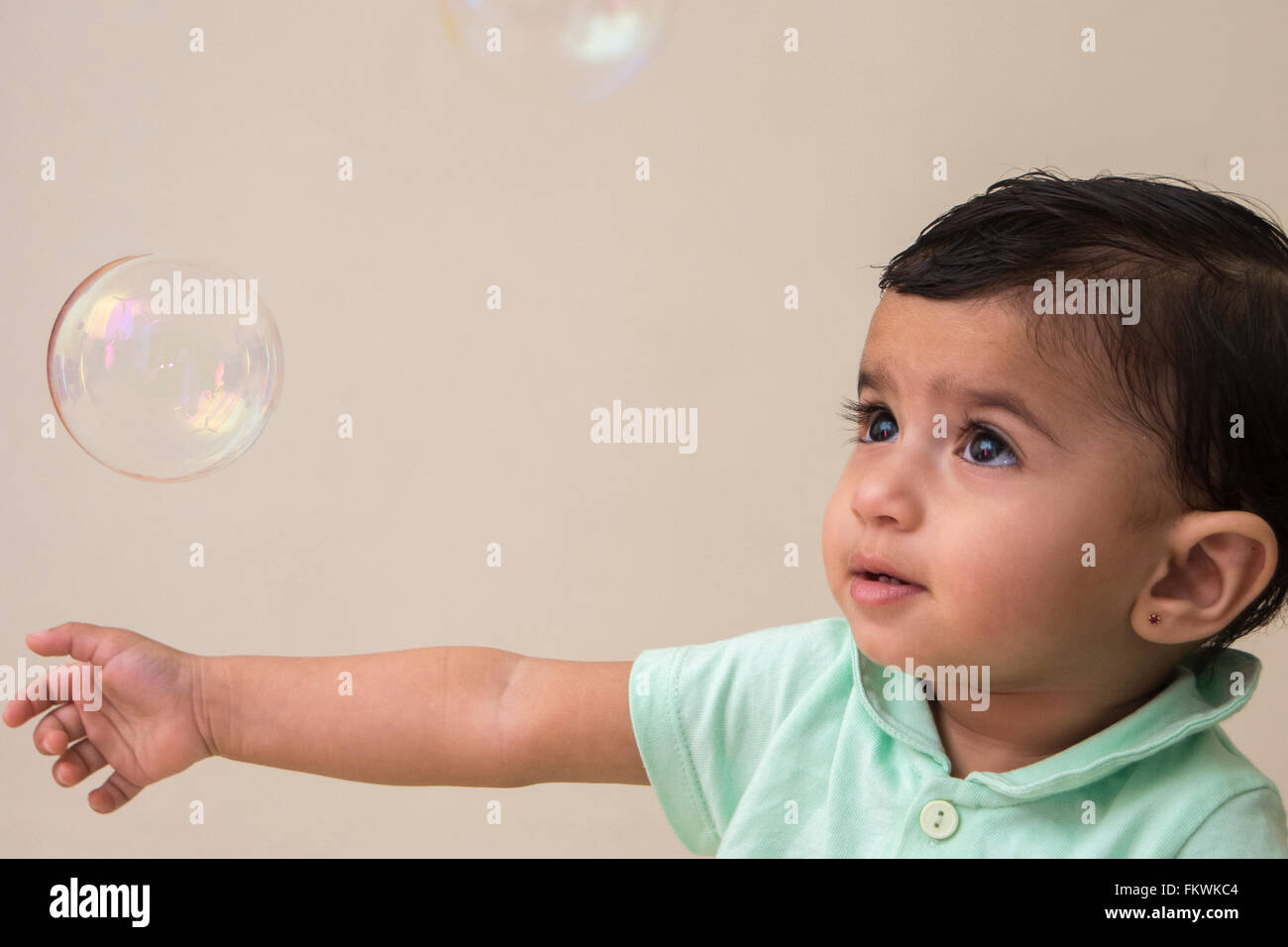 baby playing with bubbles Stock Photo - Alamy