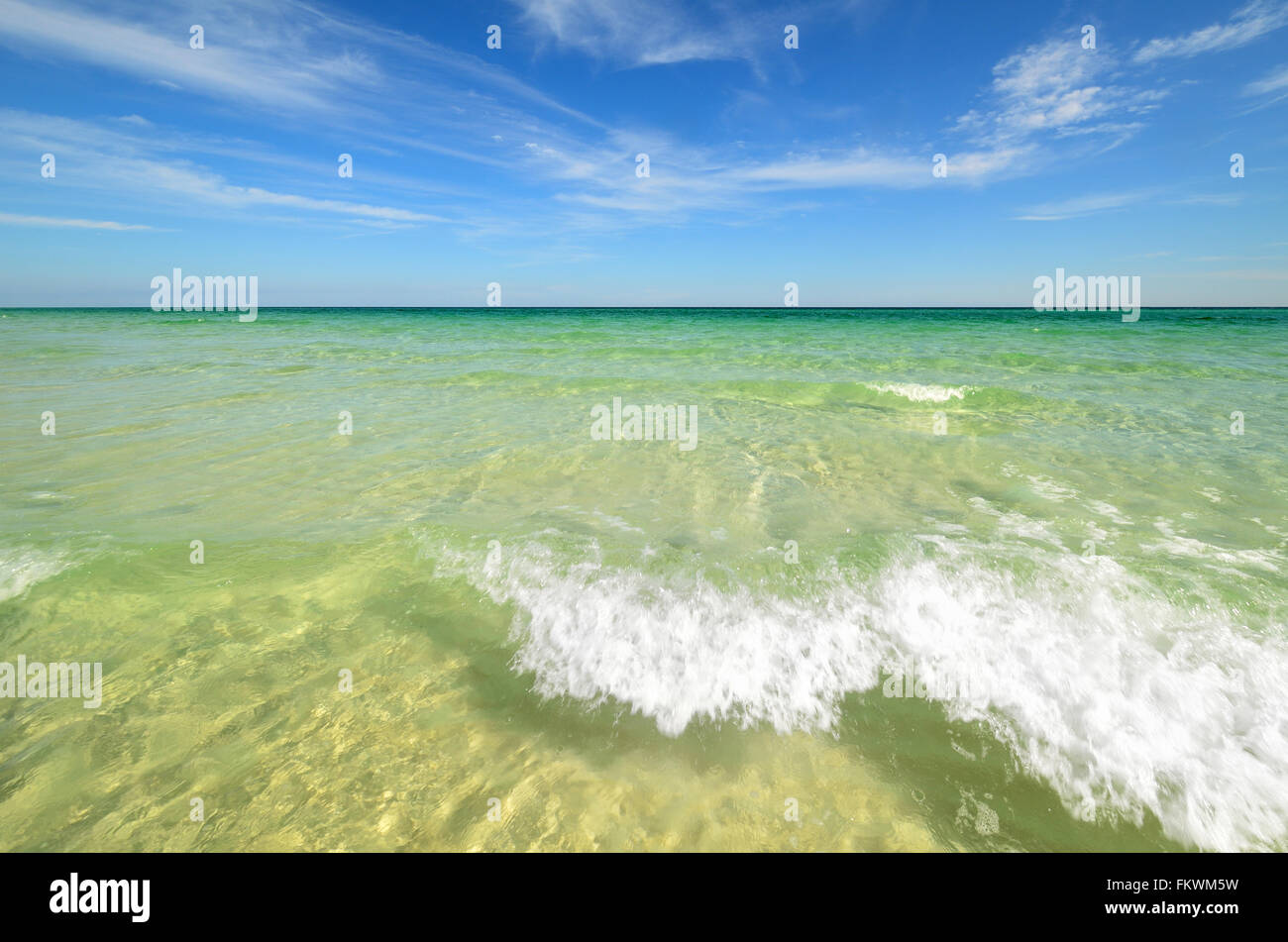 Tropical paradise beach with bright yellow sand and crystal clear green ...