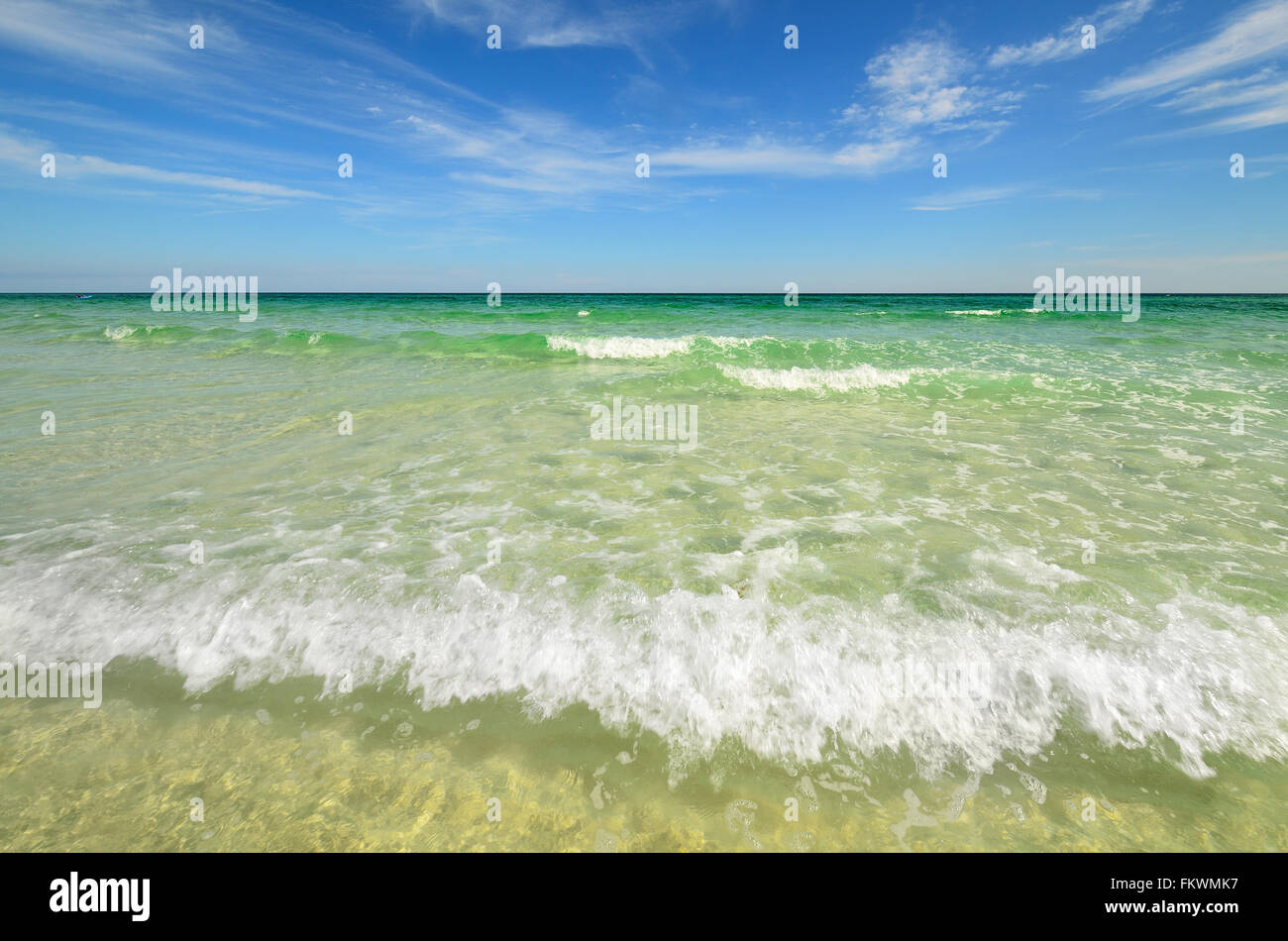 Tropical paradise beach with bright yellow sand and crystal clear green ...