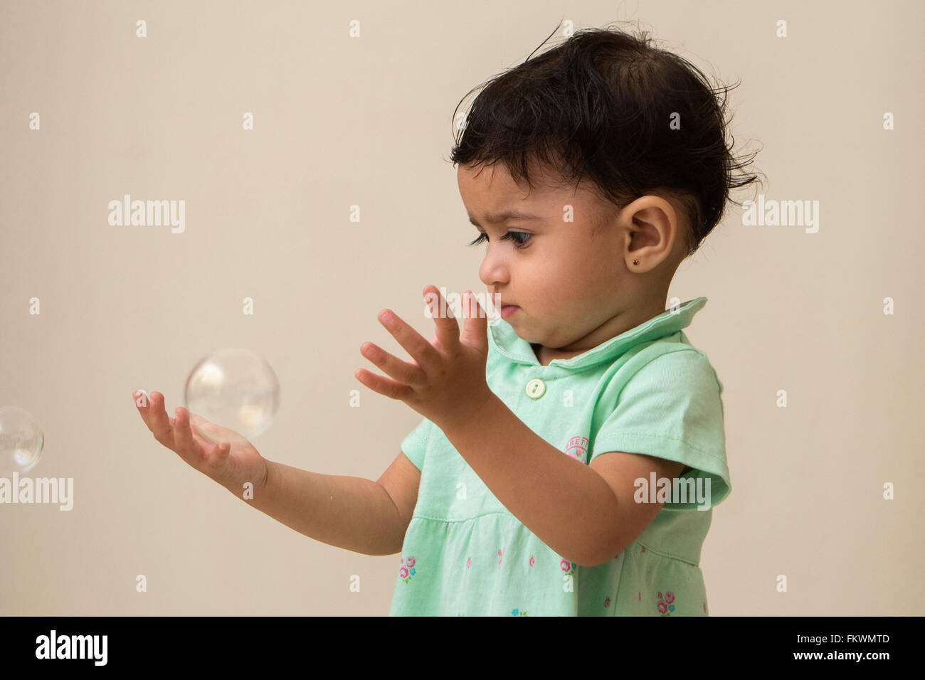 baby playing with bubbles Stock Photo - Alamy