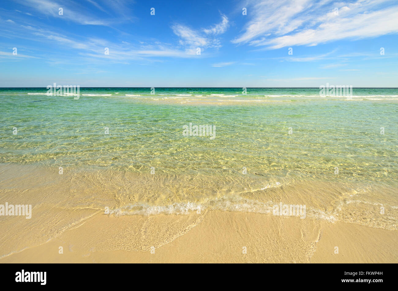 Tropical paradise beach with bright yellow sand and crystal clear green ...