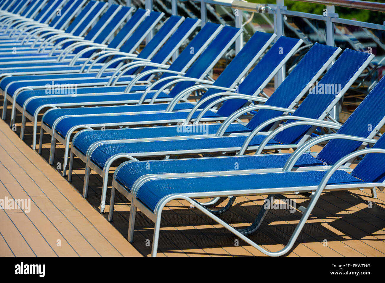 A lot of blue sunbed into a cruise ship on summer day Stock Photo - Alamy