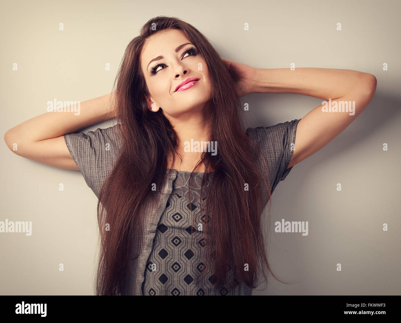Thinking make-up beautiful female model relax near the wall. Vintage ...