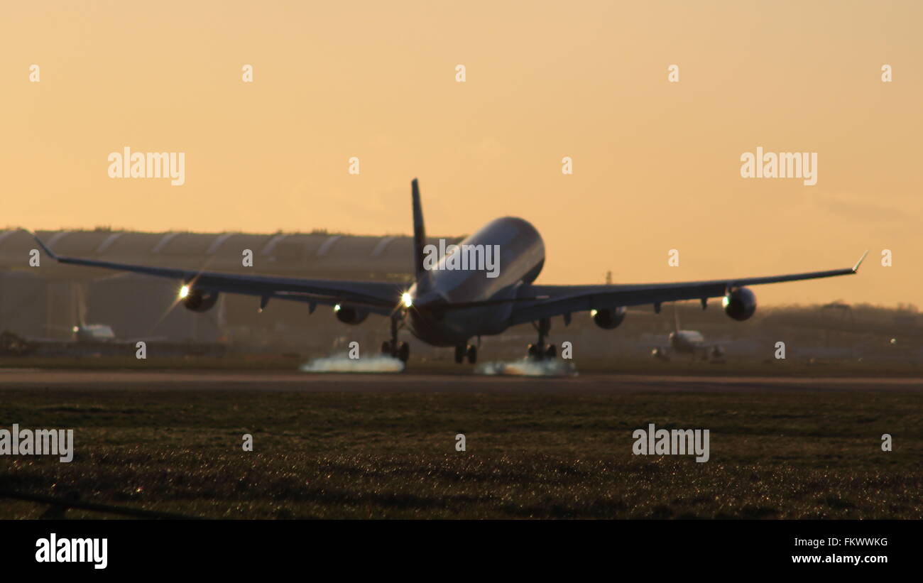 A340 Touchdown at London Heathrow Airport Stock Photo - Alamy