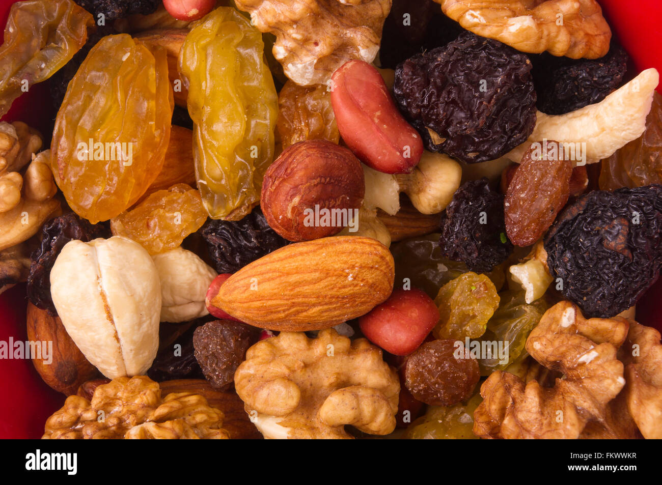 various different mixed nuts and raisins on wooden background Stock ...