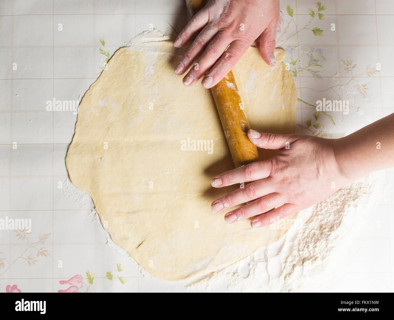 Making dough by female hands on wooden table background Stock Photo - Alamy