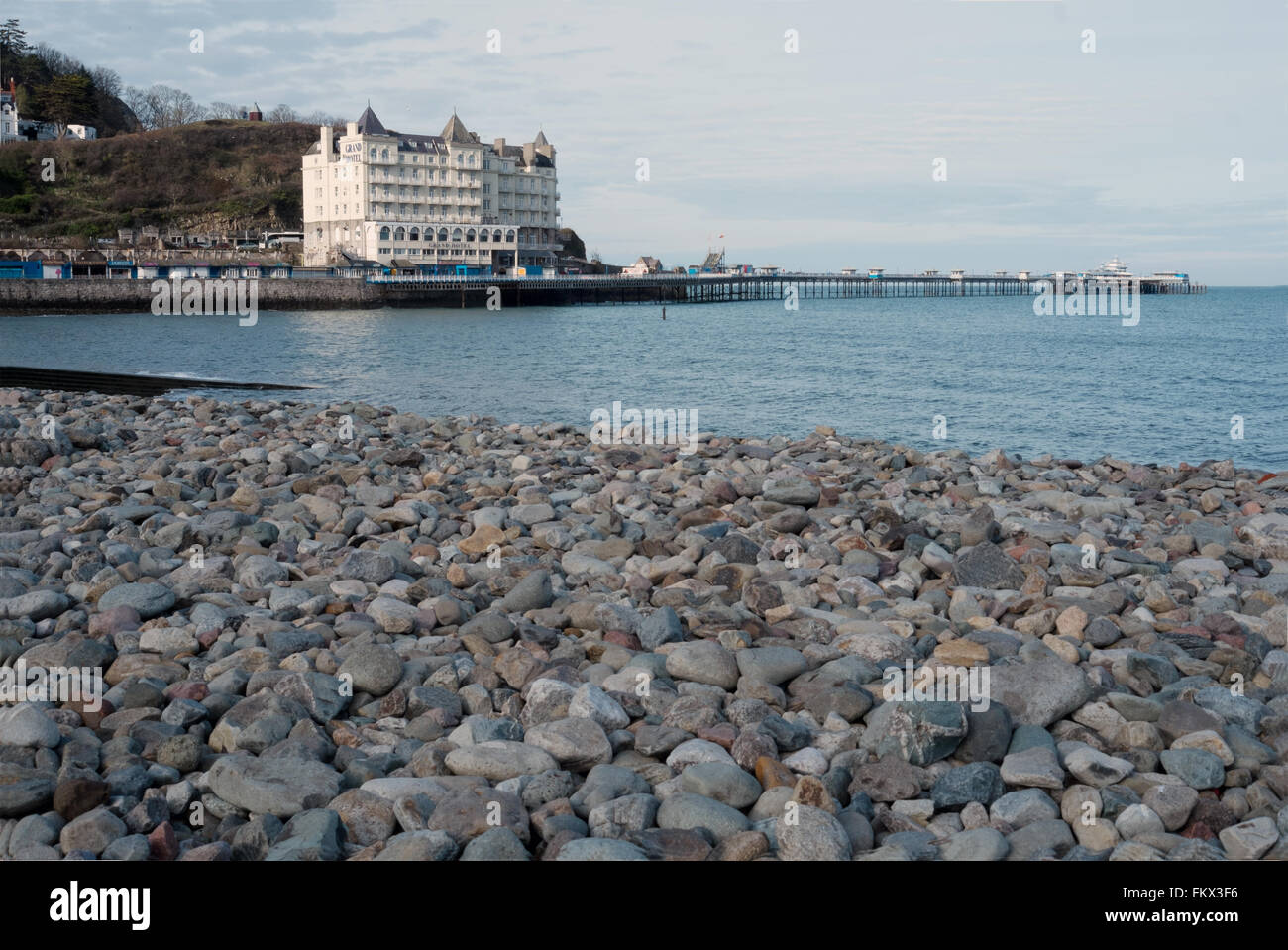 The Grand Hotel and Llandudno Pier photographed from the pebble beach ...