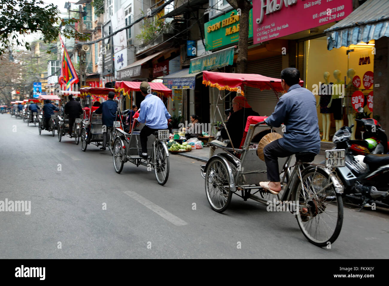 Cyclo (three-wheel cycle taxi) riders, Old Quarter, aka The 36 Streets ...