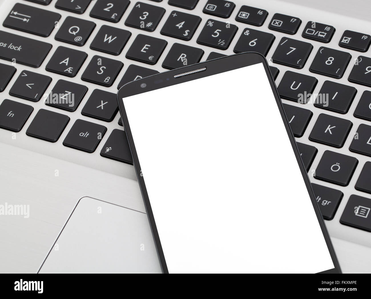 smartphone mock up on laptop computer Stock Photo - Alamy