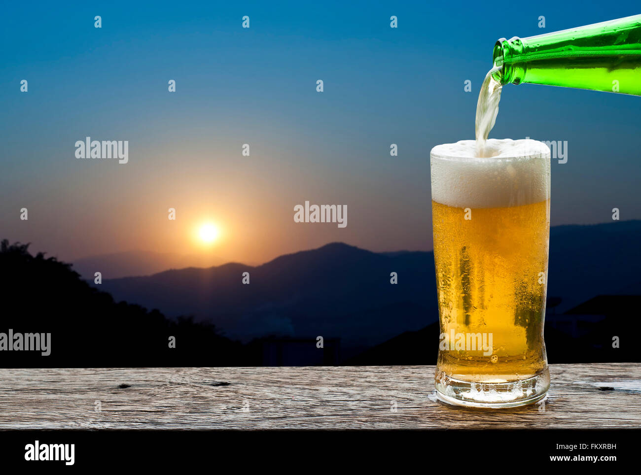 Enjoy beer with sunset Stock Photo - Alamy