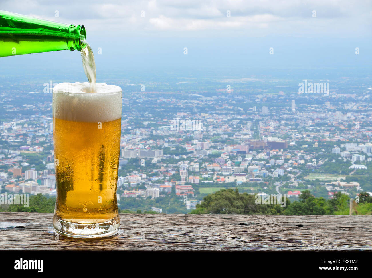 Enjoy beer with urban cityscape Stock Photo - Alamy