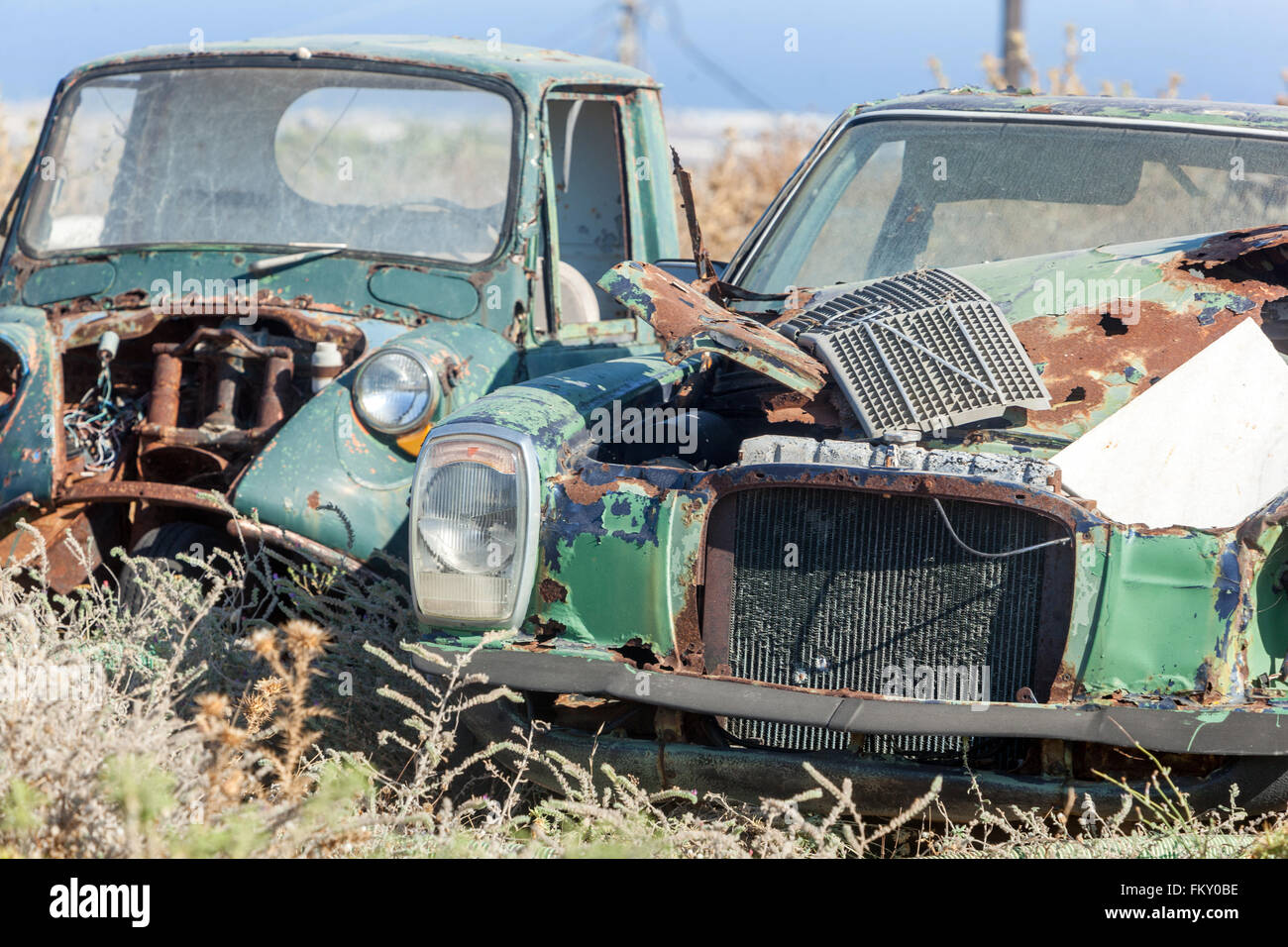 Old rusted Mercedes Benz abandoned decay cars in landscape, Santorini, Greece Rusty cars wreck ...