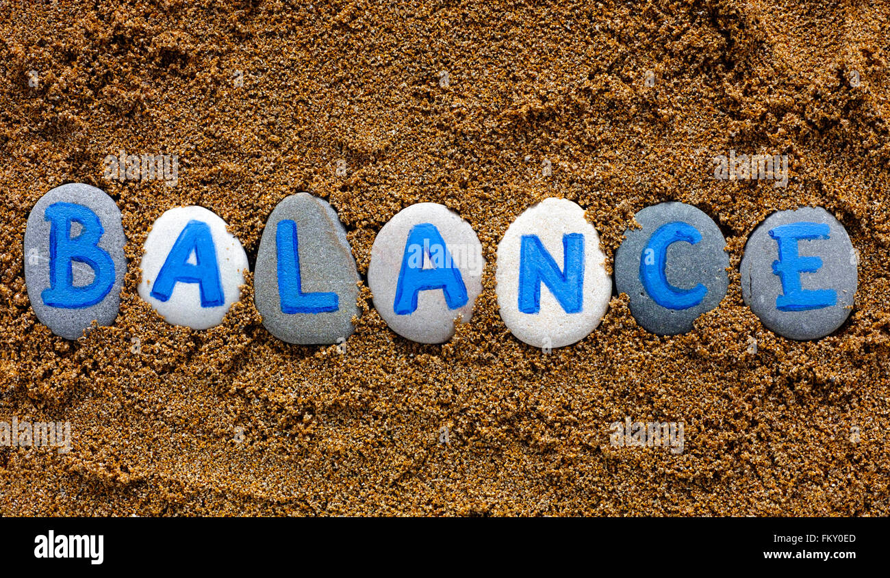 Word Balance spell out from stones with letters on sea sand. Letters ...
