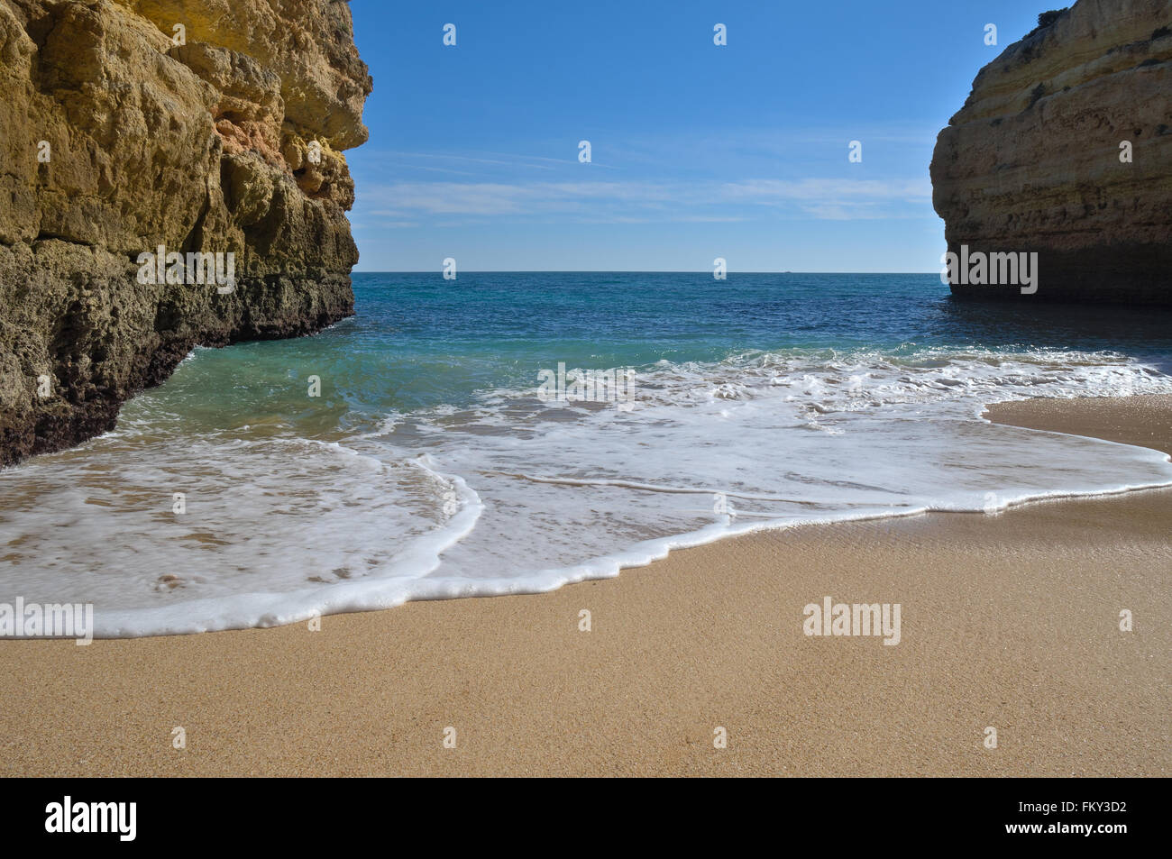Water meets sand and cliff in Fontainhas beach. Algarve, Portugal Stock ...