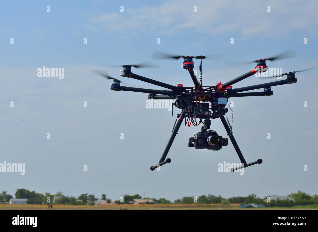 flying helicopter with camera over meadow Stock Photo - Alamy