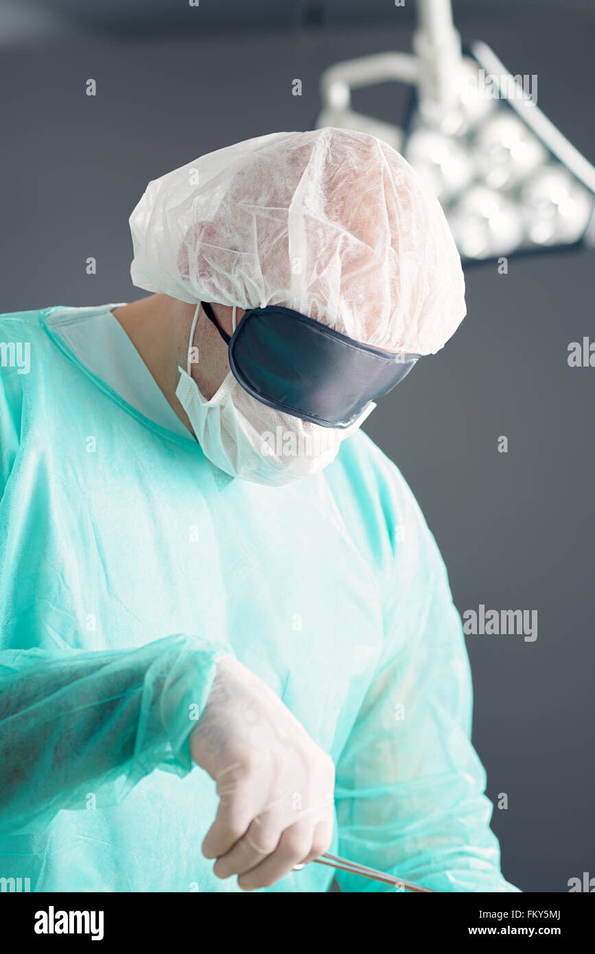 Blindfolded surgeon performing a surgery Stock Photo - Alamy