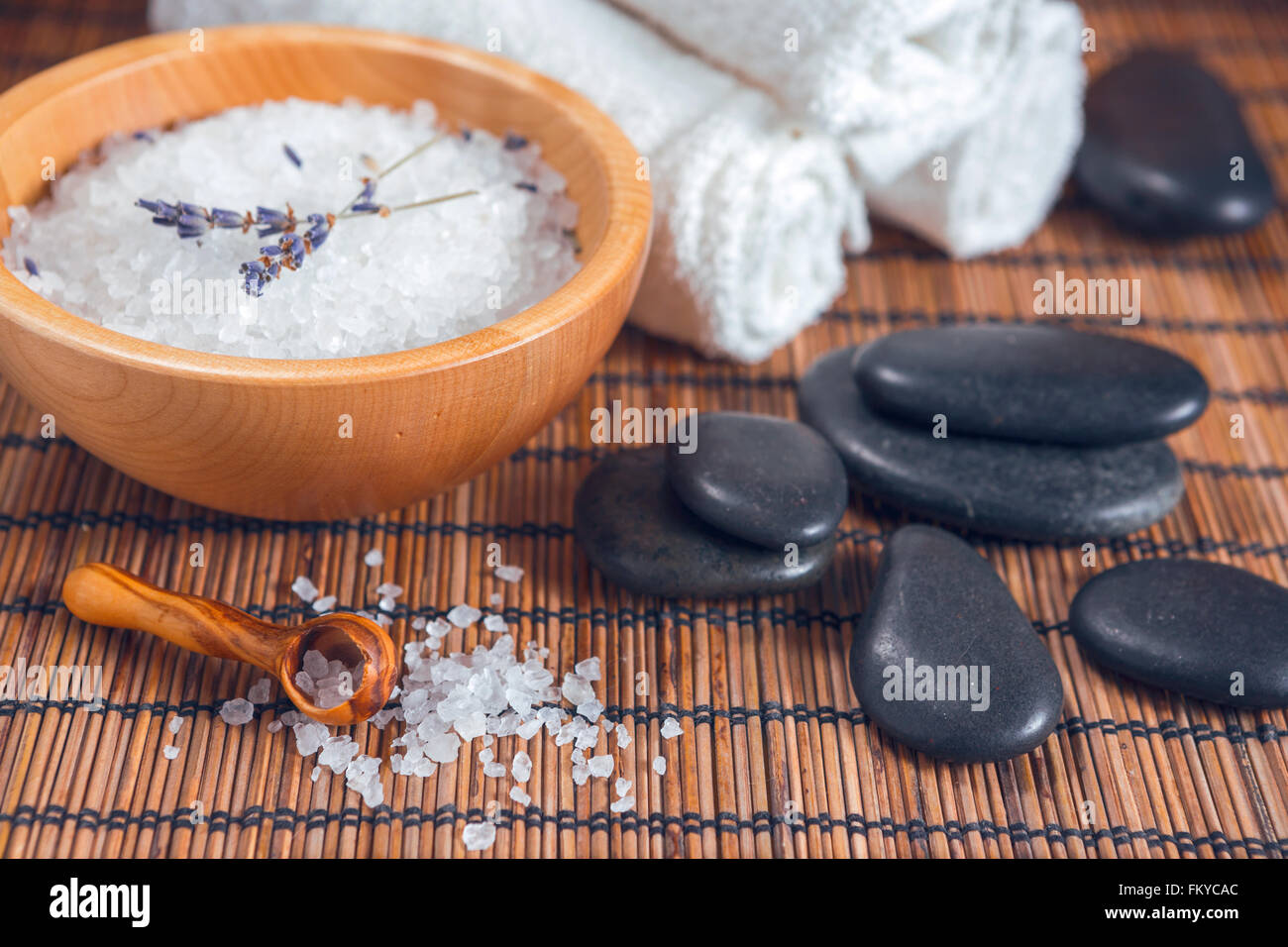 Spa and wellness setting with Zen stones, natural soap, sea salt and ...