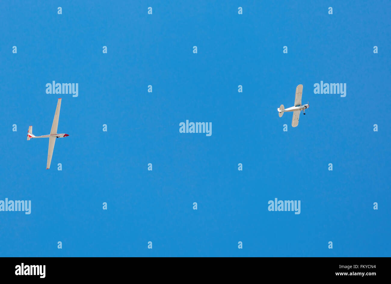 Plane pulling of a glider with tourists Stock Photo - Alamy