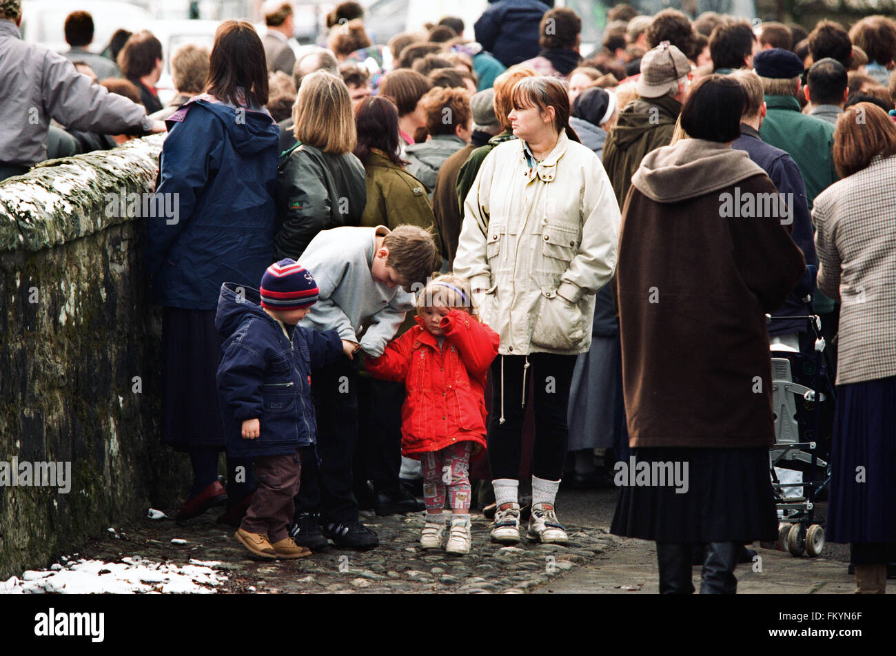 Children and adults gather outside Dunblane primary school, Scotland ...