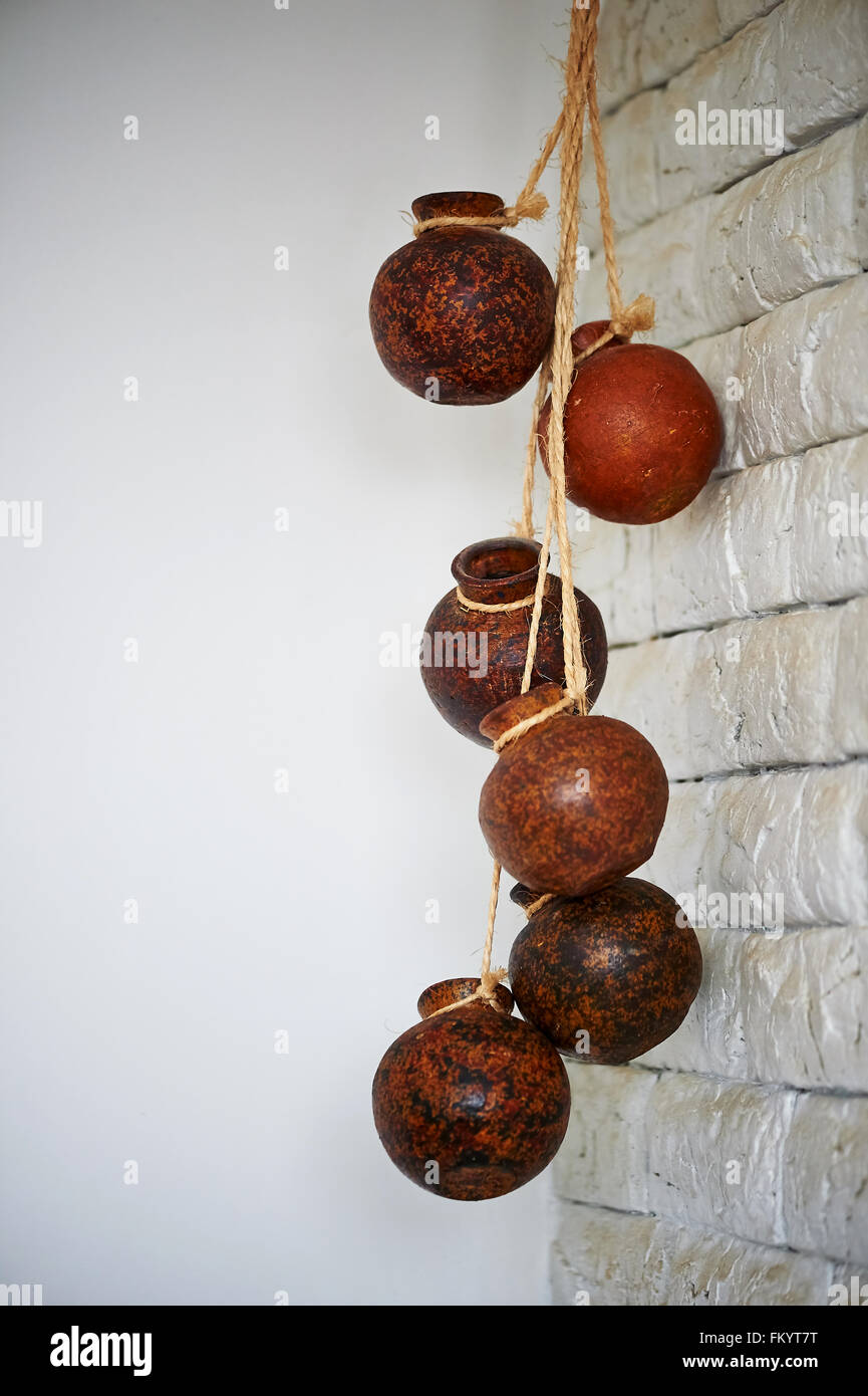 many ethnic wooden pots hanging on the rope Stock Photo - Alamy