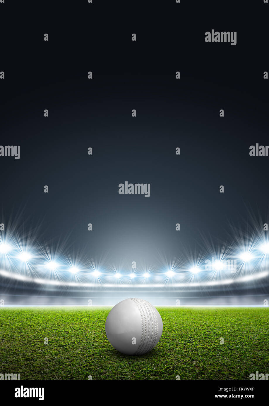 A generic stadium with an unmarked green grass pitch at night under ...