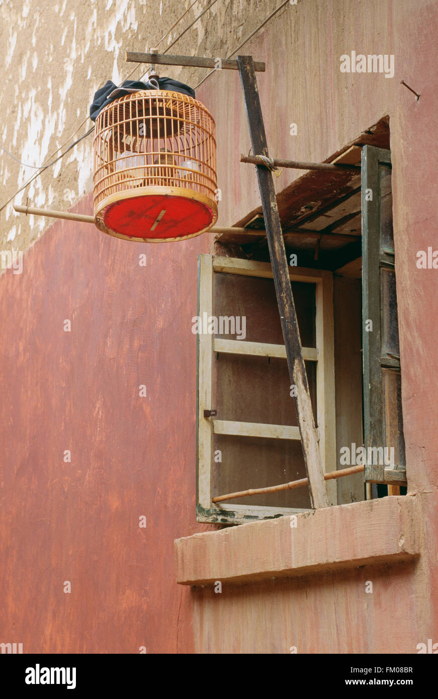 Bird Cage hanging from a window, Beijing, China Stock Photo - Alamy