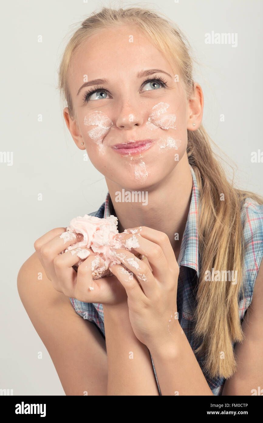 happy fun girl eating dessert Stock Photo - Alamy
