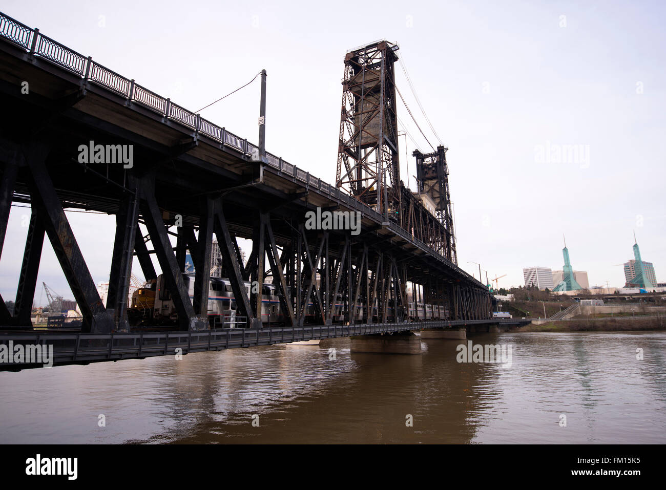 Old metal drawbridge with all kinds of traffic, including trains, cars ...