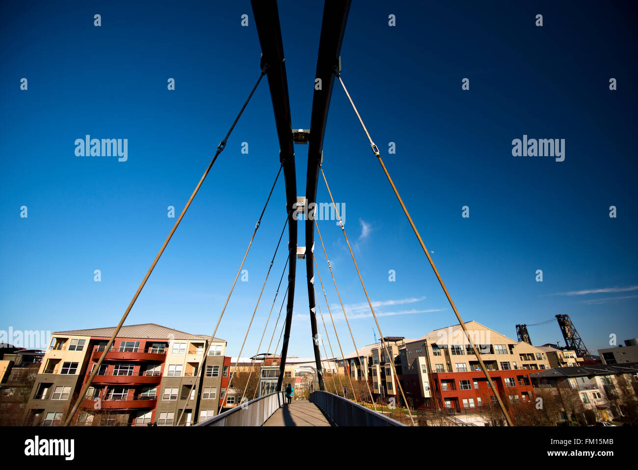 Arched rope pedestrian modern bridge in urban Pearl District in Down ...